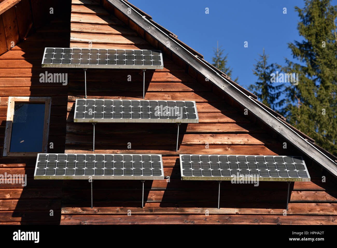Solar panel on a wooden cottage in the forest Stock Photo - Alamy