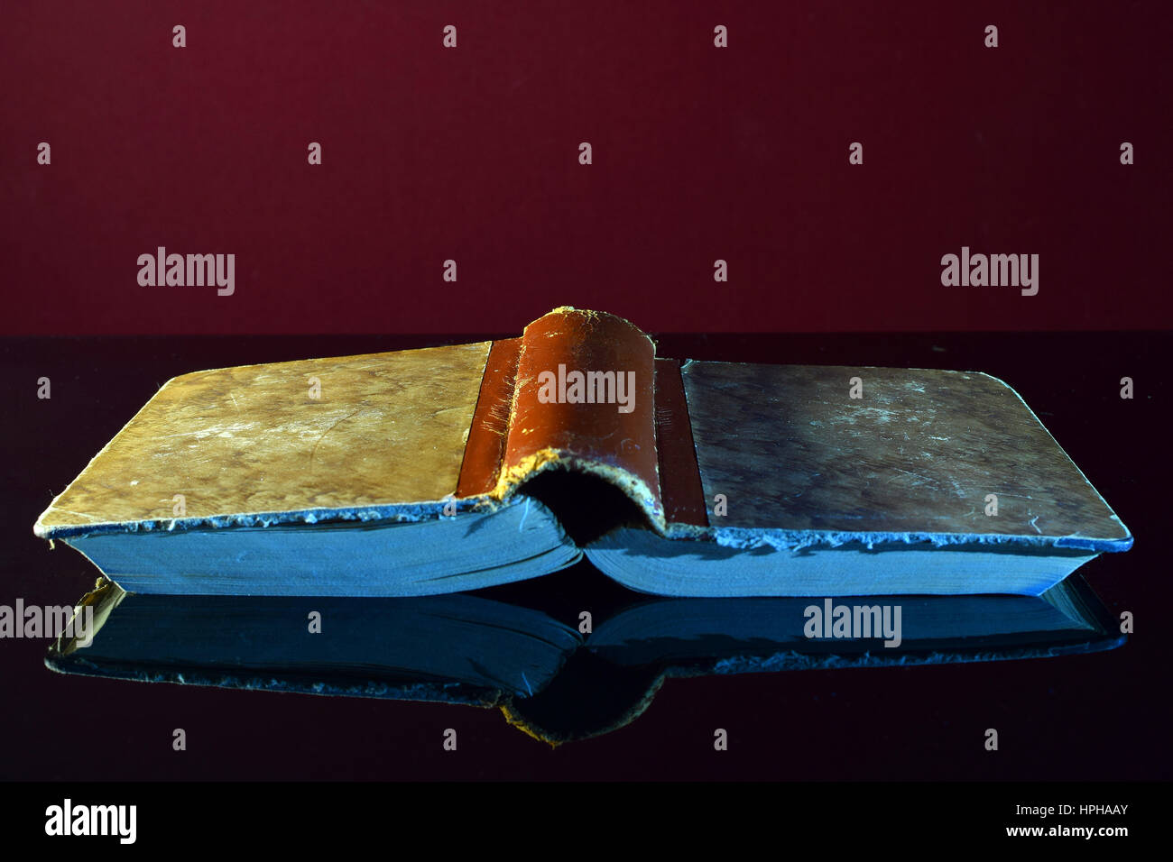 Open old book upside down Stock Photo - Alamy