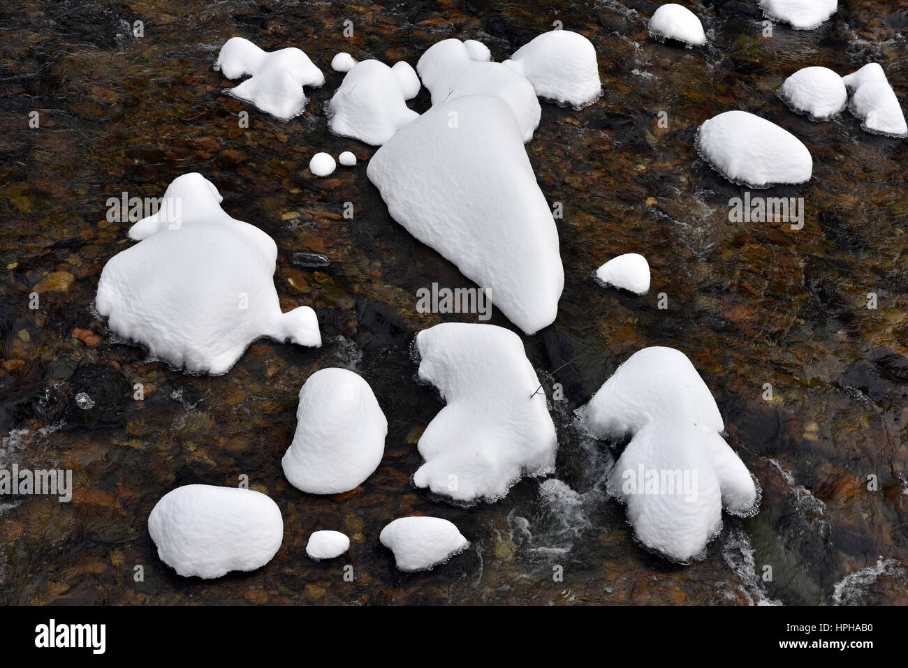Small water stream, river covered with snow at winter Stock Photo - Alamy