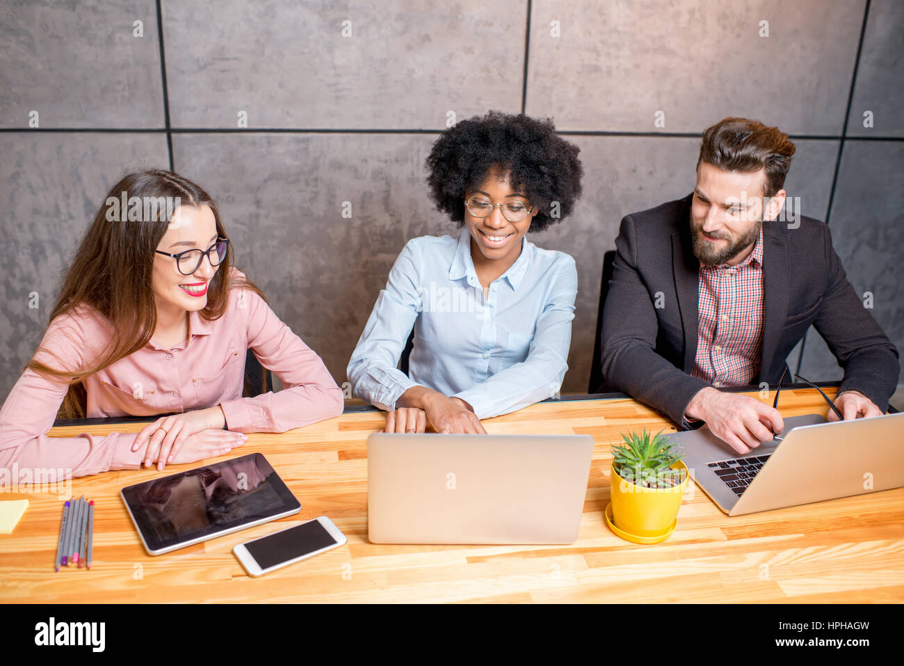 Coworkers at the office Stock Photo - Alamy