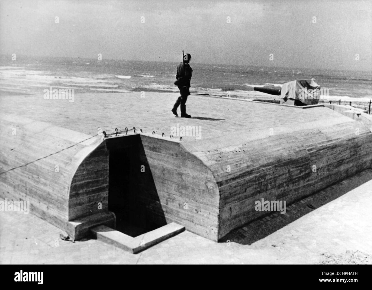 The Nazi propaganda image shows a German Wehrmacht sentry on the roof ...