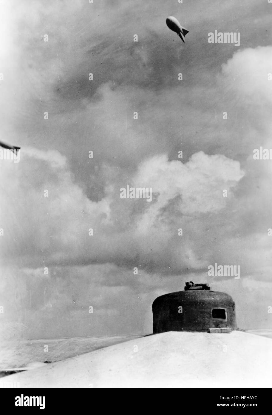 The Nazi propaganda image shows barrage balloons and bunkers on a ...
