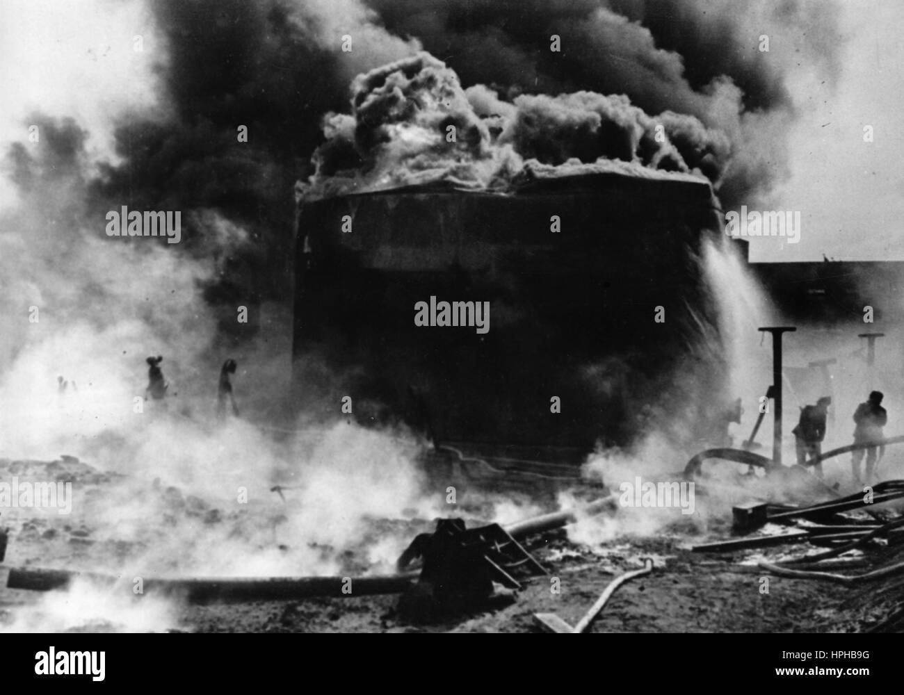 The Nazi propaganda image shows burning Shell oil company tankers in ...