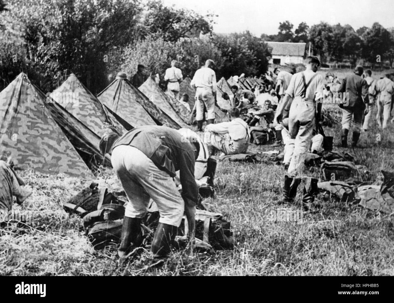 The Nazi propaganda image shows German Wehrmacht soldiers in a ...