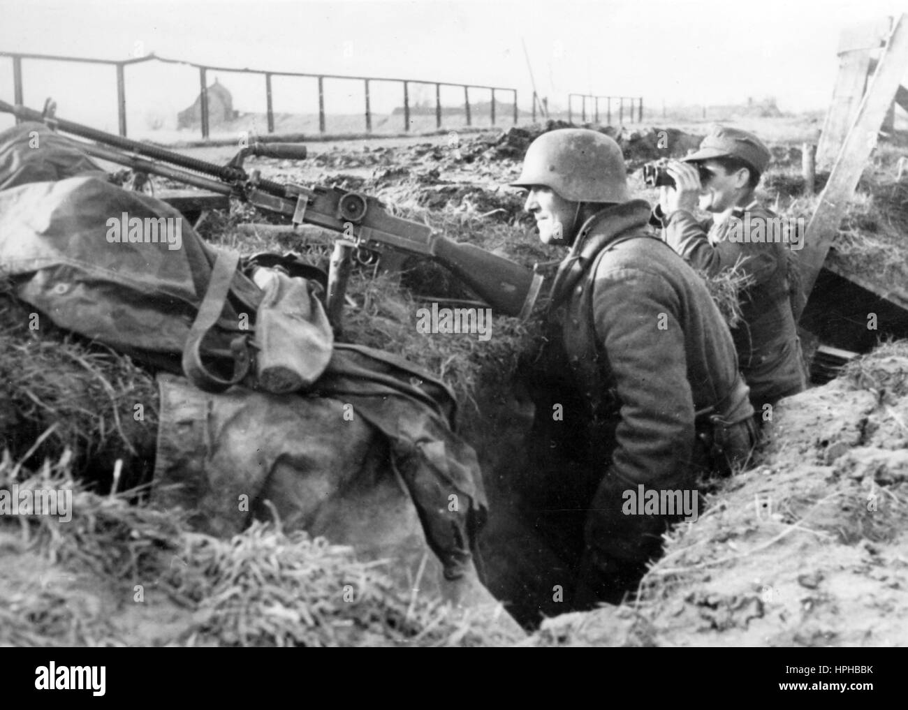 The Nazi propaganda image shows German Wehrmacht soldiers in a position ...