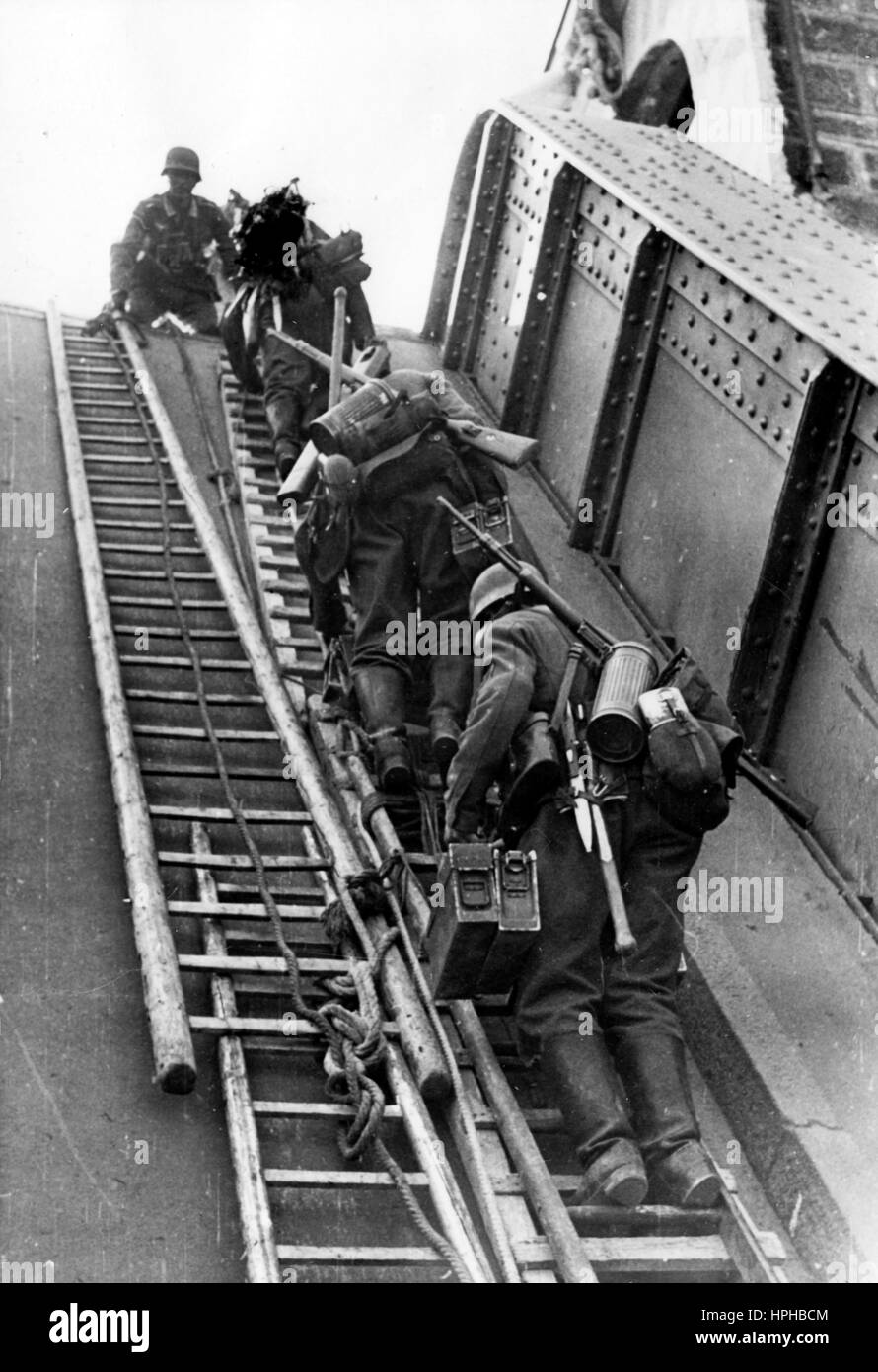 The Nazi propaganda image shows German Werhmacht soldiers on ladders ...