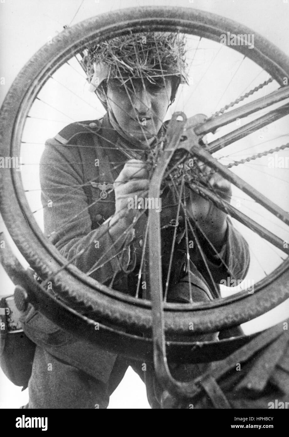 The Nazi propaganda image shows a member of a German Wehrmacht bicycle ...