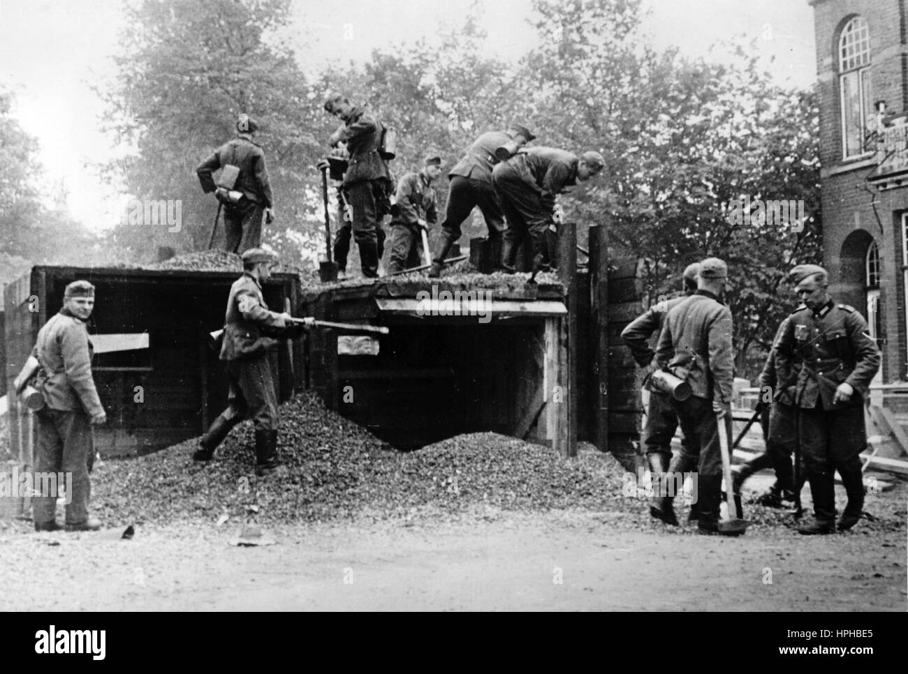 The Nazi propaganda image shows German Wehrmacht engineers removing ...