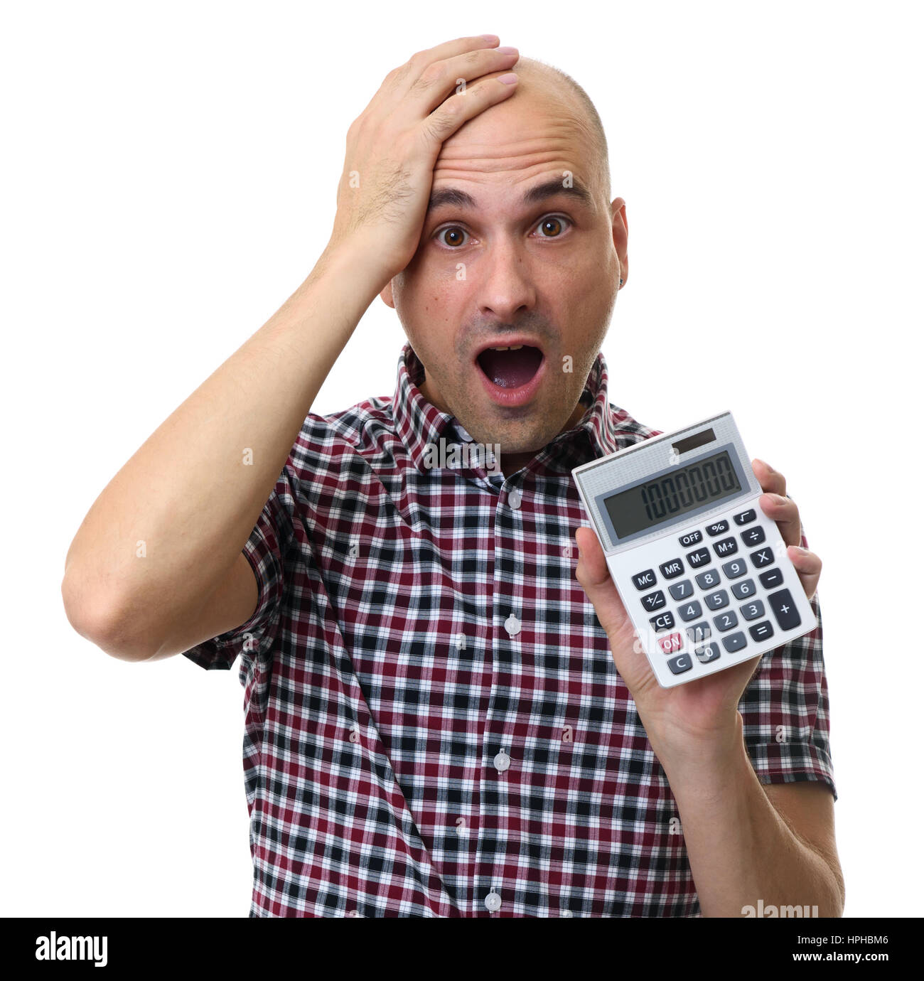 Shocked man holding a calculator isolated on white background Stock ...