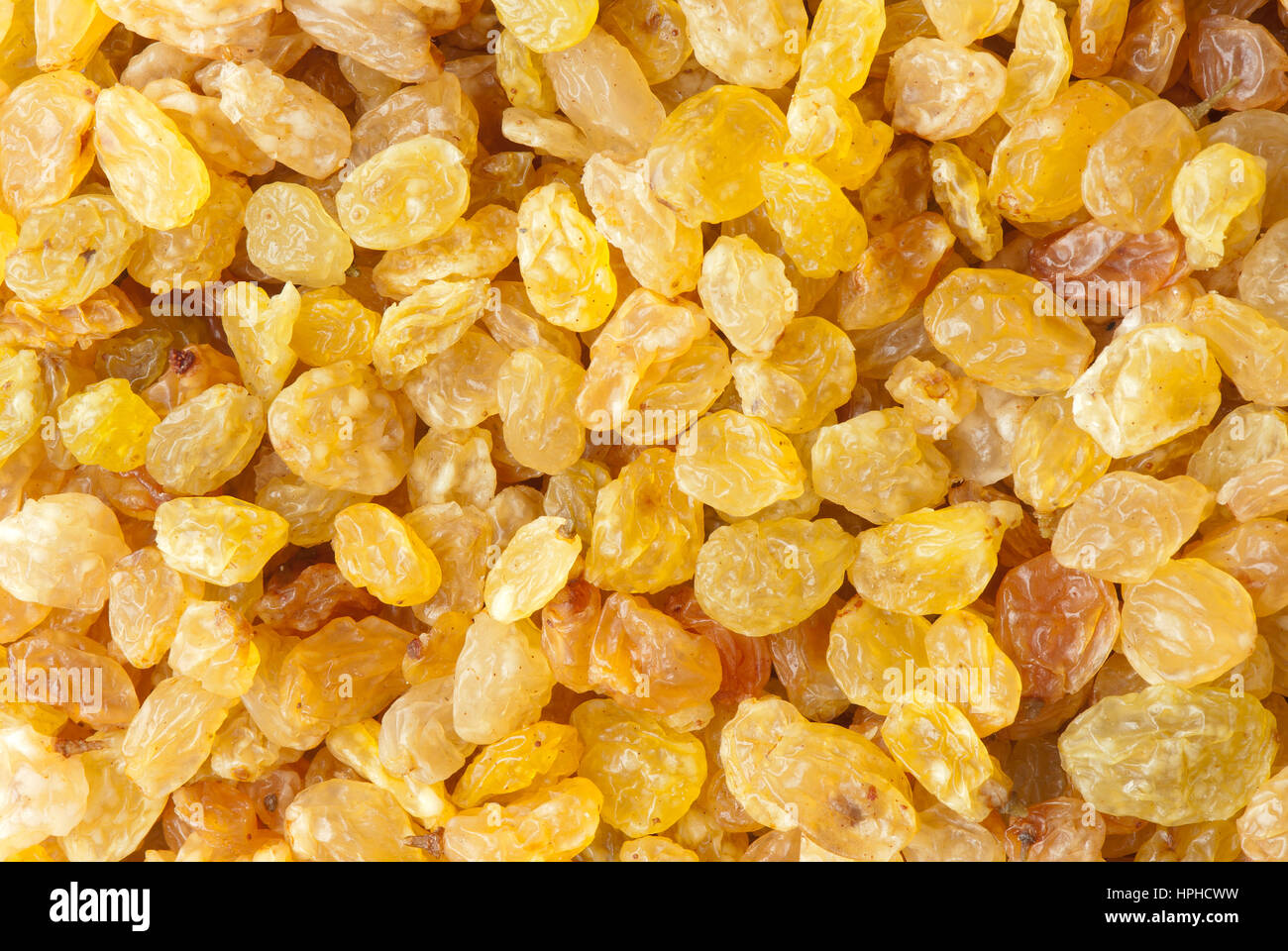 golden raisins background Stock Photo - Alamy