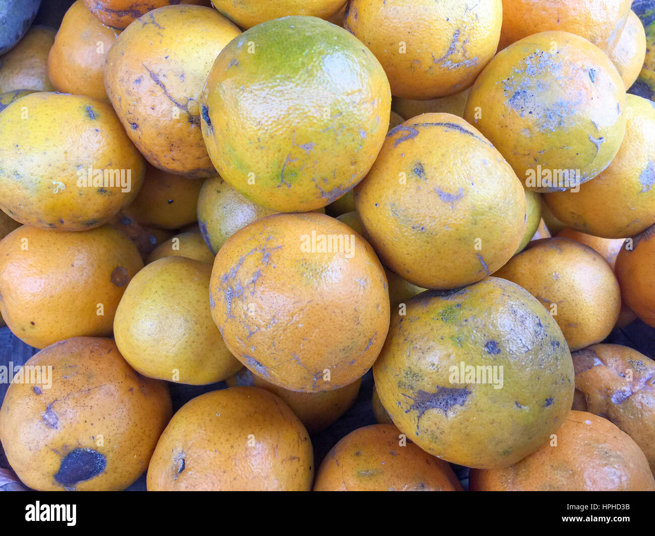 Mandarin lime on display in street market Stock Photo - Alamy