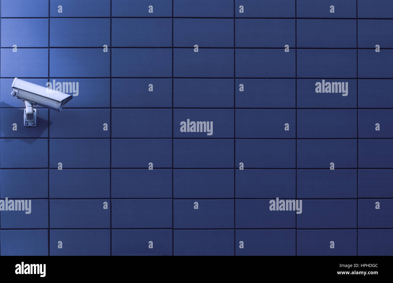 Horizontal front view of a surveillance monitoring white camera viewed ...