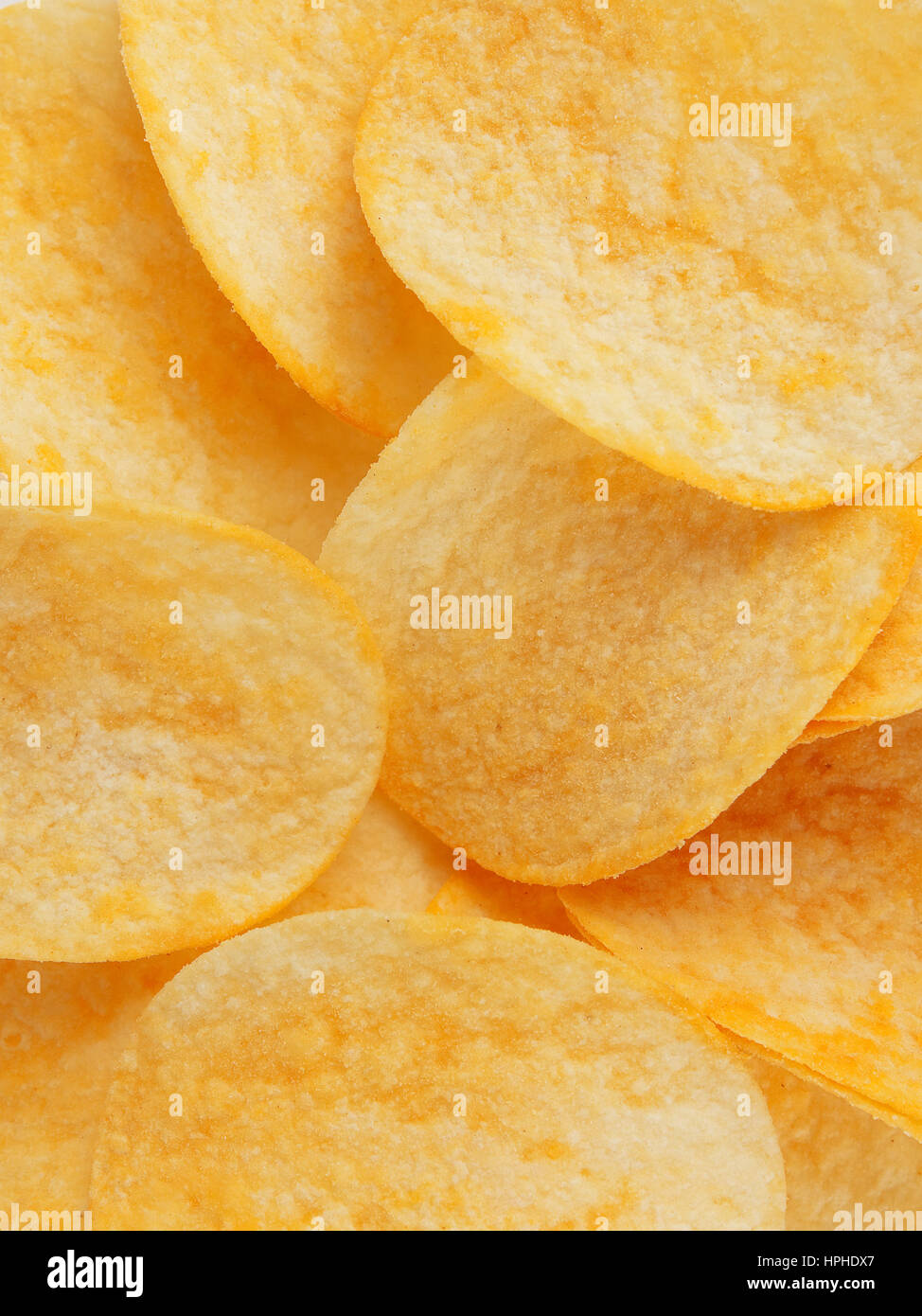 Potato chips background Stock Photo - Alamy