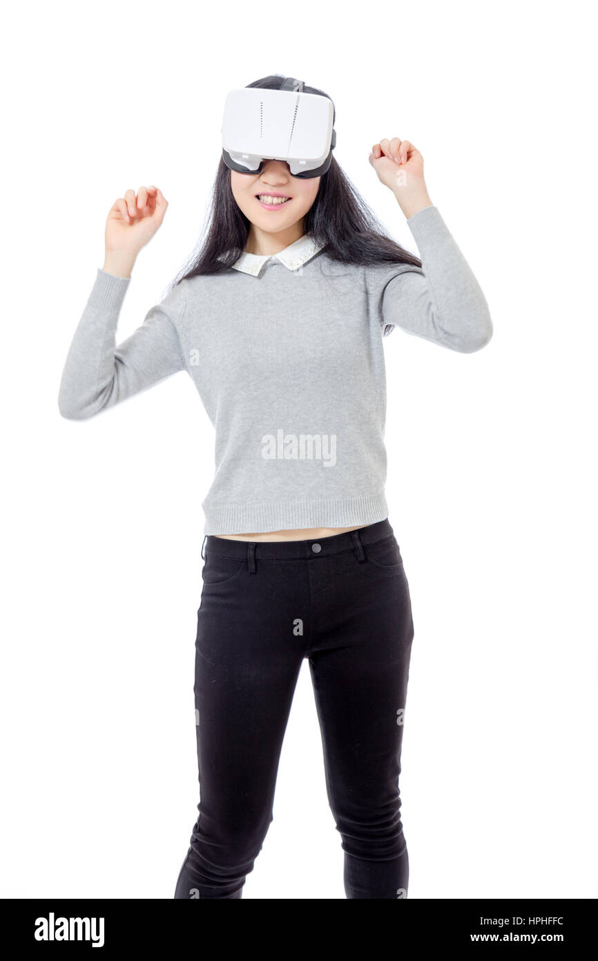 Teenage girl wearing 3D VR goggles, dancing and smiling Stock Photo - Alamy