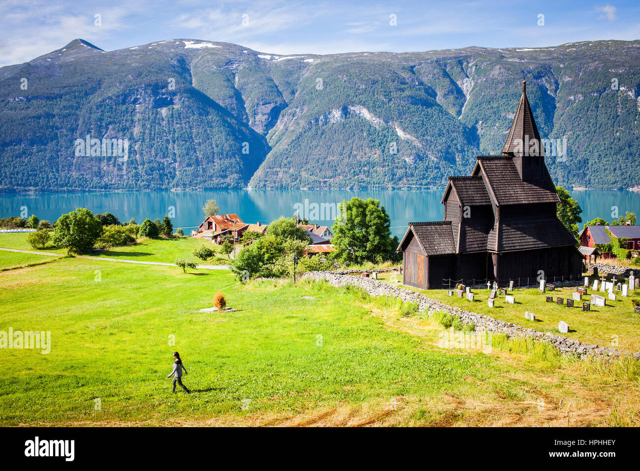 Urnes stave church at Lustrafjord fjord, branch of the Sognefjord fjord ...