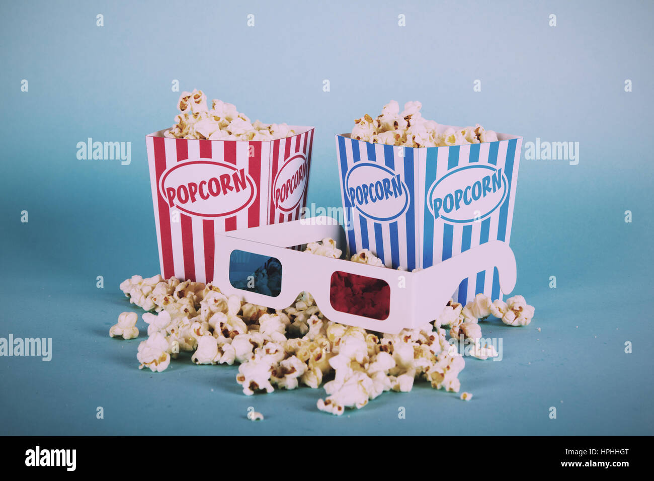 Bucket of popcorn against a blue background Vintage Retro Filter Stock ...