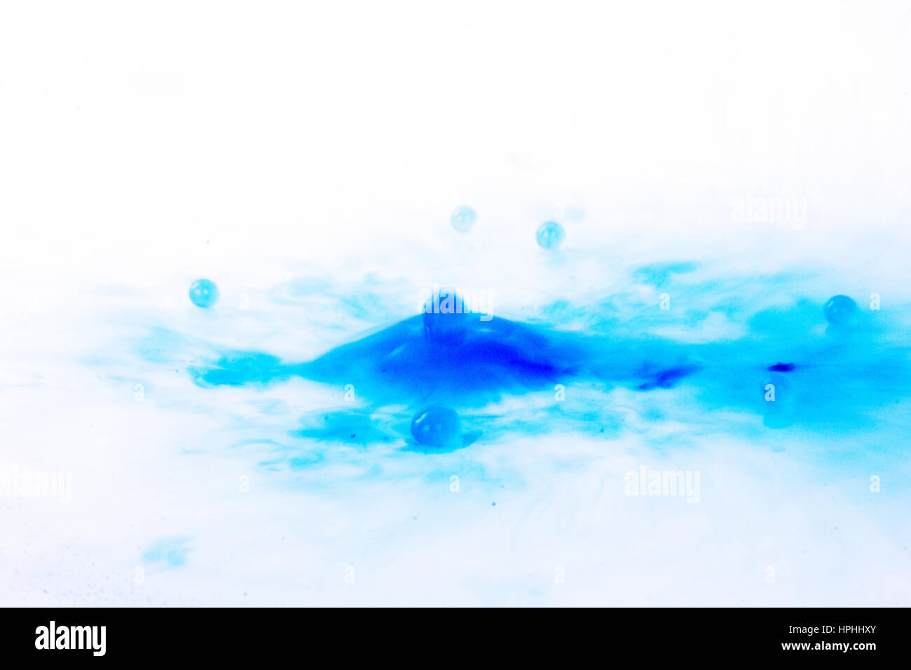 Colorful paint drop splashing on black a background Stock Photo - Alamy