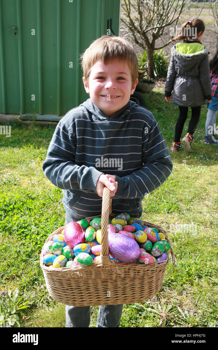 Young boy with basket of Easter Eggs Stock Photo - Alamy