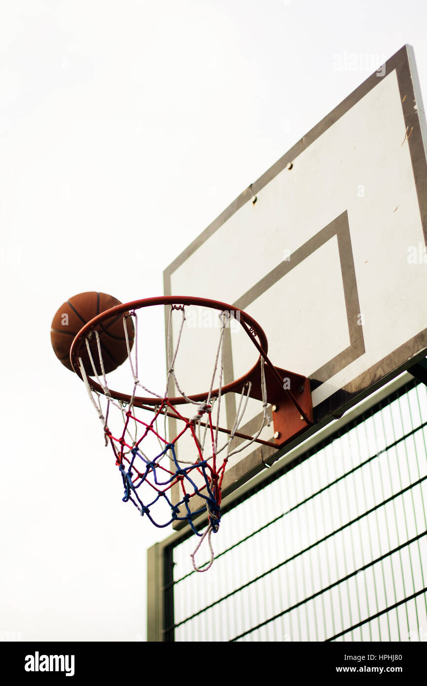 Basketball hoop outside in a school play area Stock Photo - Alamy