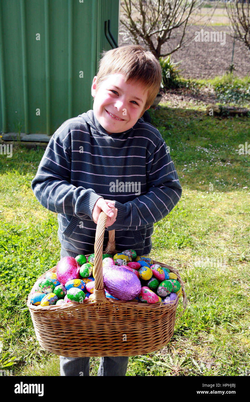 Young boy with basket of Easter Eggs Stock Photo - Alamy