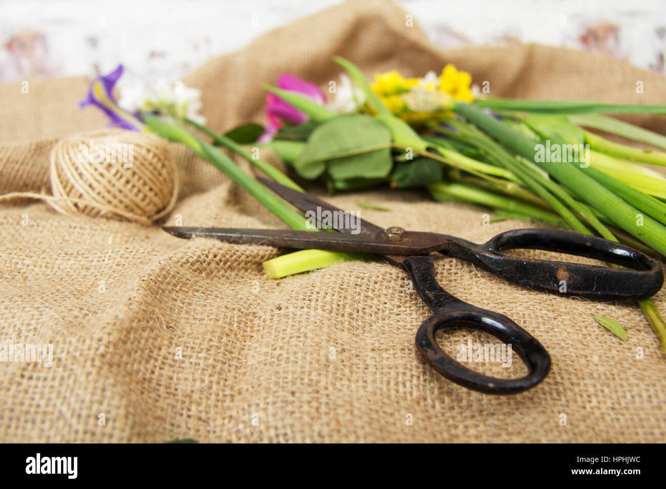 Spring cut flower arrangement against a rustic background Stock Photo ...
