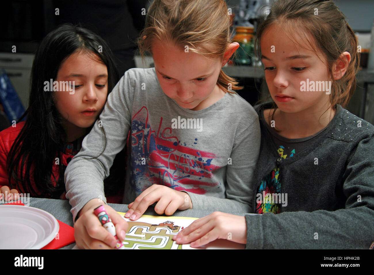 Girls colouring together Stock Photo - Alamy