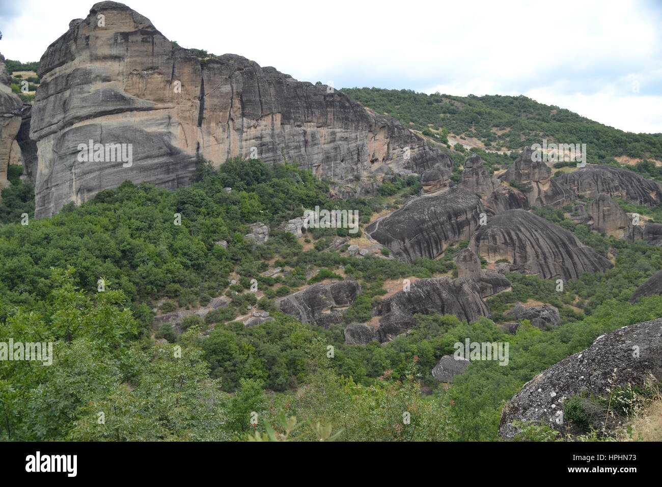 Meteora is formation of immense monolithic pillars and hills-like huge ...