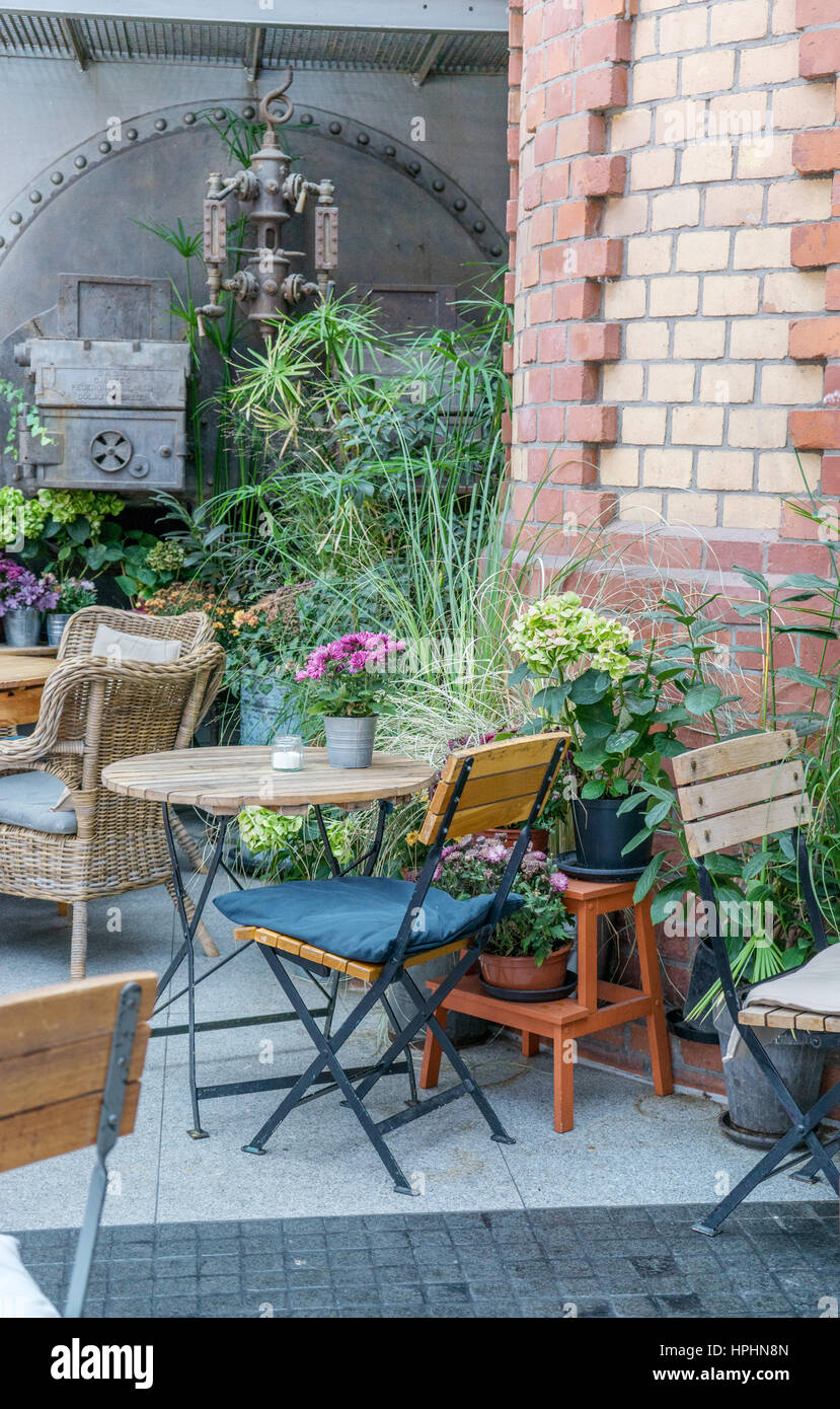 Terrace with tables, chairs, plants and decoration Stock Photo - Alamy