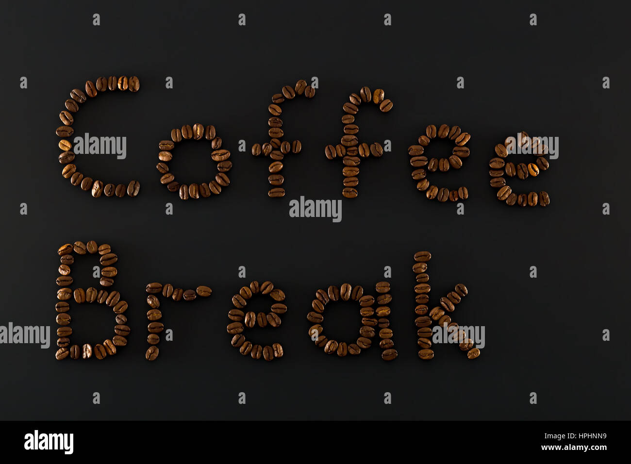 Coffee break letter words consist of brown coffee beans Stock Photo - Alamy