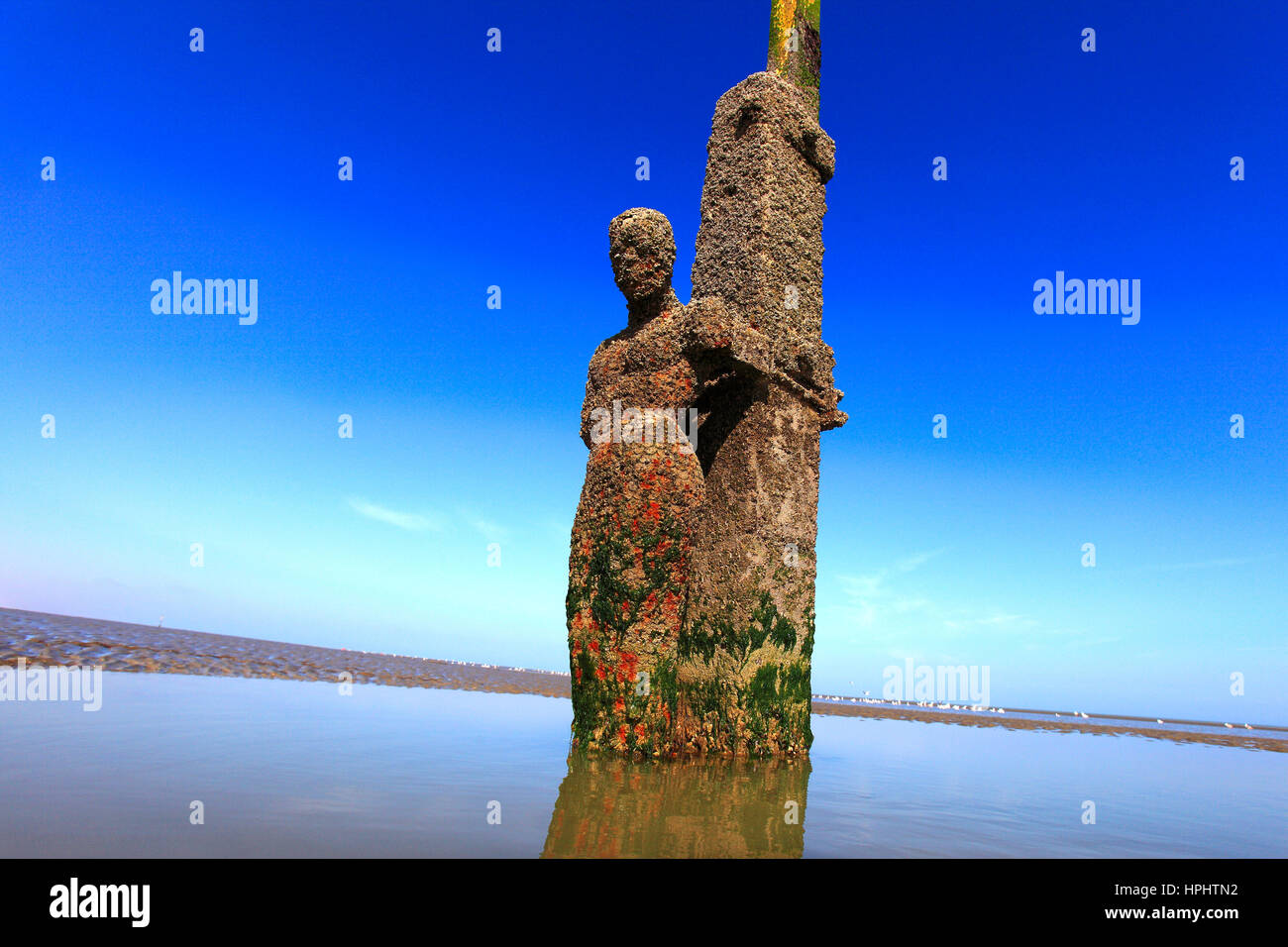 Belgium, Oostduinkerke, Bizarre statue on the beach at low tide Stock ...