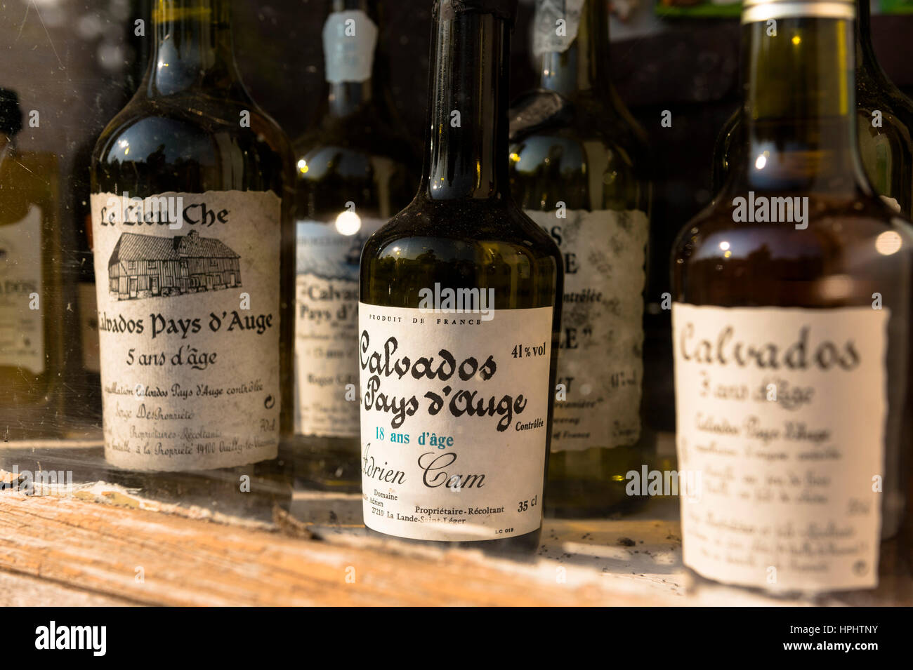 France, Normandy, bottles of old Calvados in an old shop window Stock ...