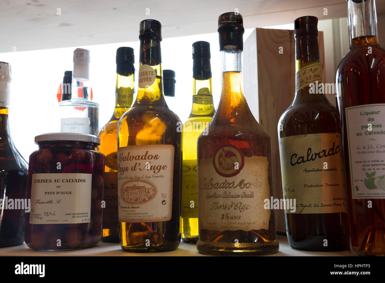 France, Normandy, bottles of Calvados on a shop shelf Stock Photo - Alamy