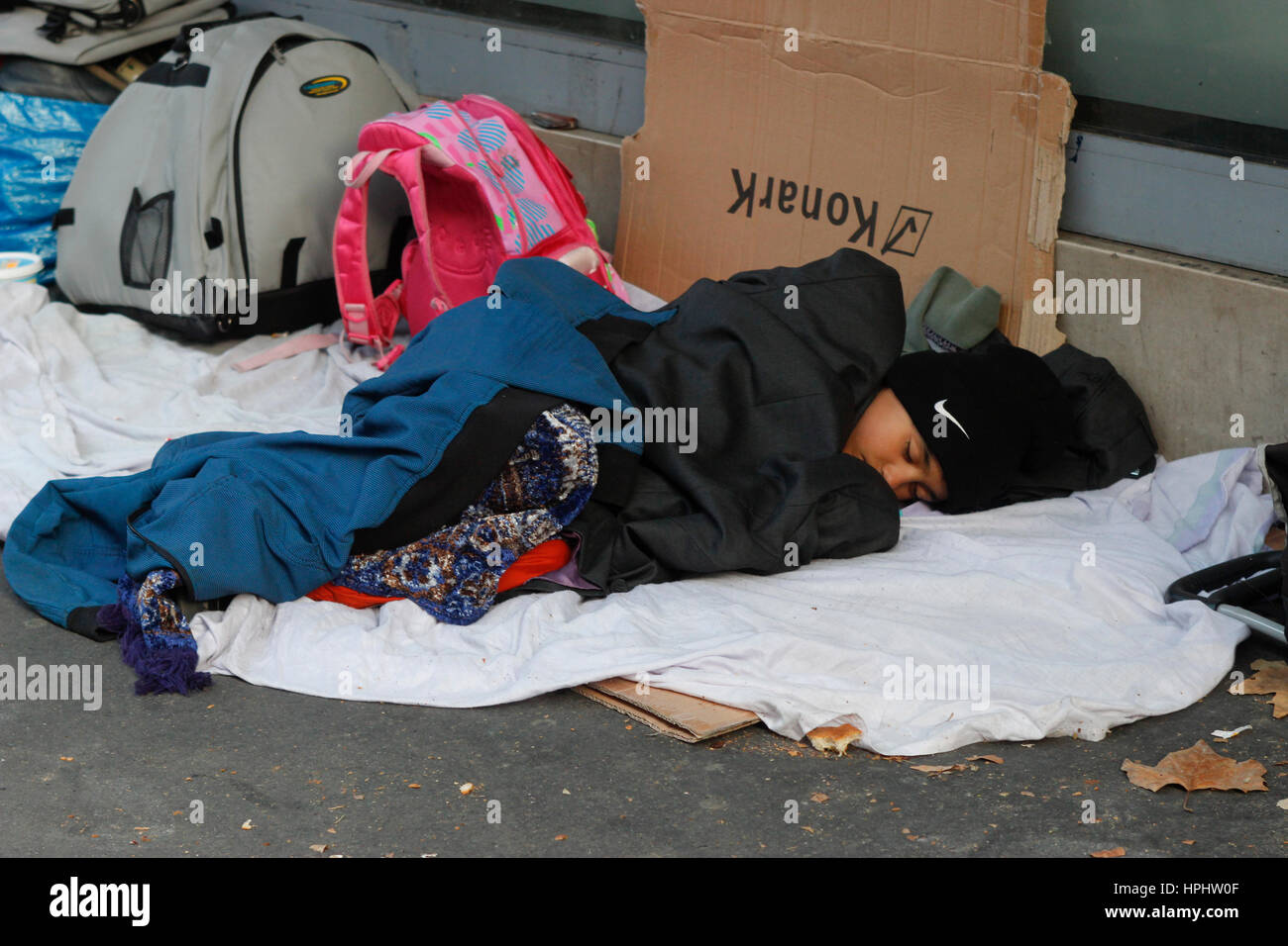 France, Paris, a sleeping homeless child on a sidewalk Stock Photo - Alamy