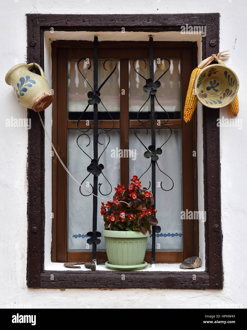 Vintage brown wooden window frame with hanged pottery Stock Photo - Alamy