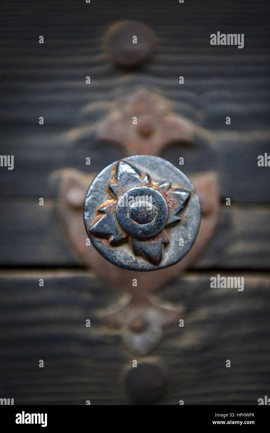 Rusty iron door knob on a vintage wooden door Stock Photo - Alamy