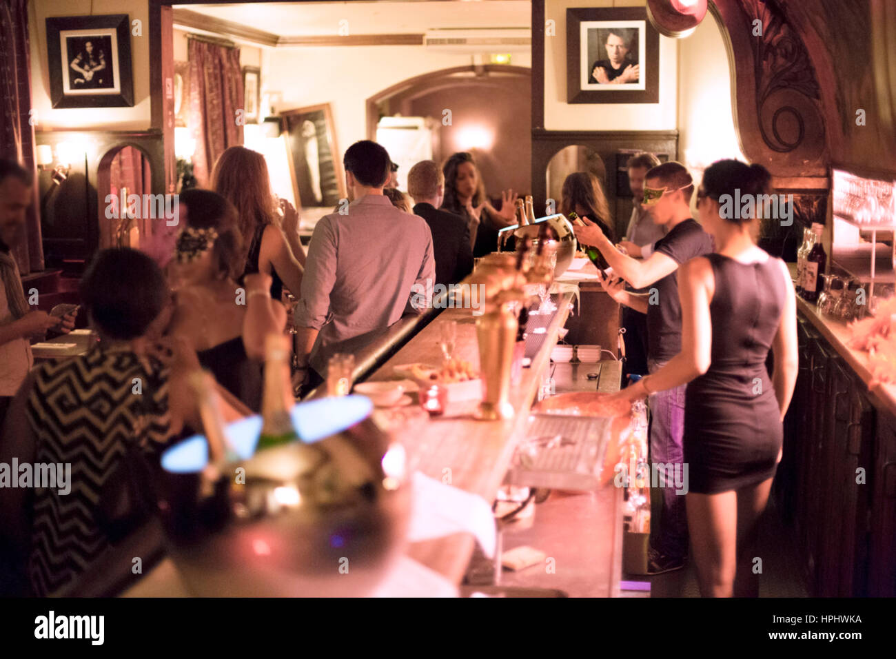 Groups of people having a drink in a festive bar and restaurant Stock ...