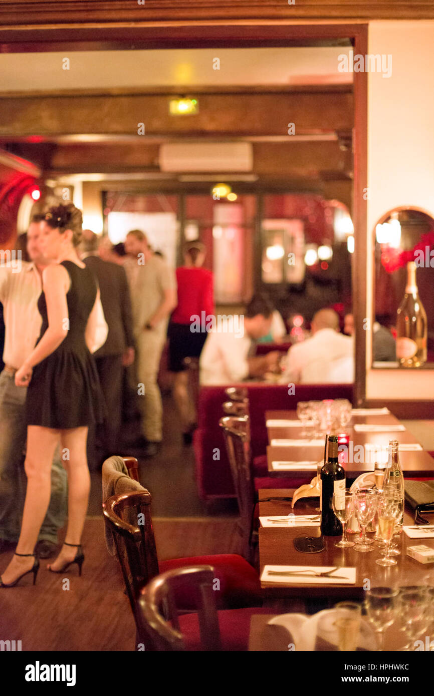 Group of people standing in a bar restaurant Stock Photo - Alamy