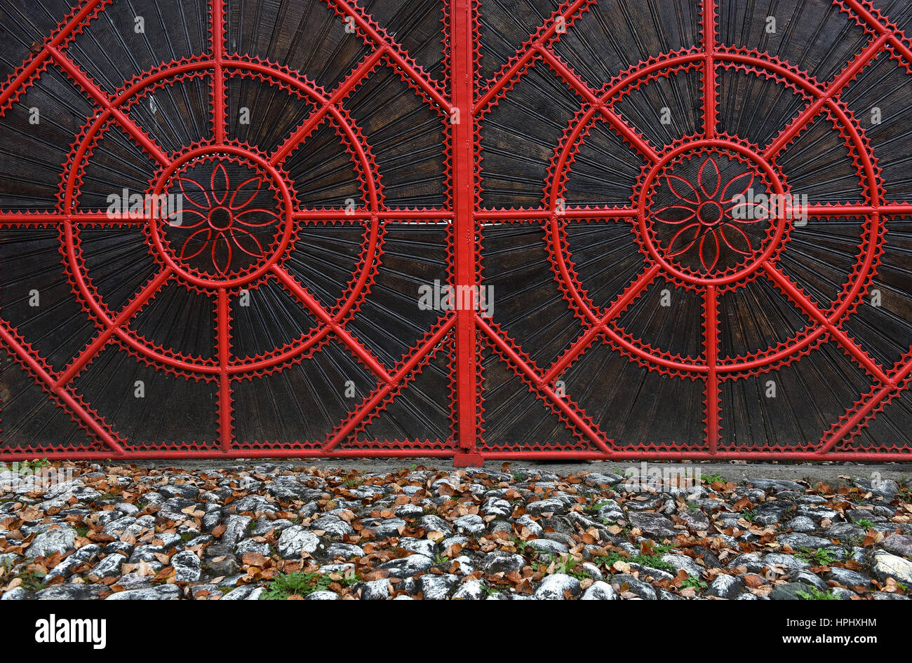 Detail of a red forged metallic gate. Forged decorative fence Stock ...