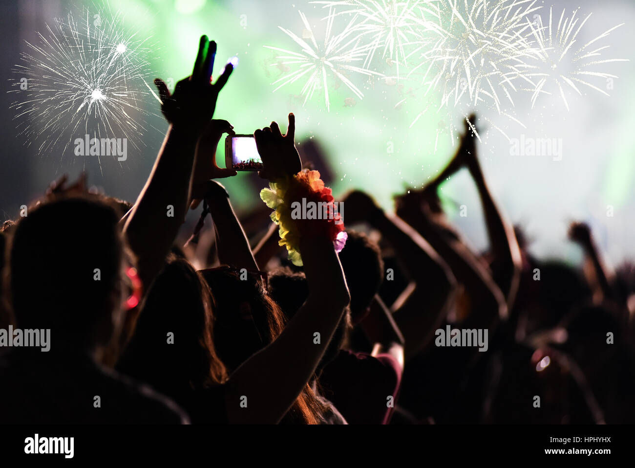 Cheering crowd and fireworks - New Year concept Stock Photo - Alamy
