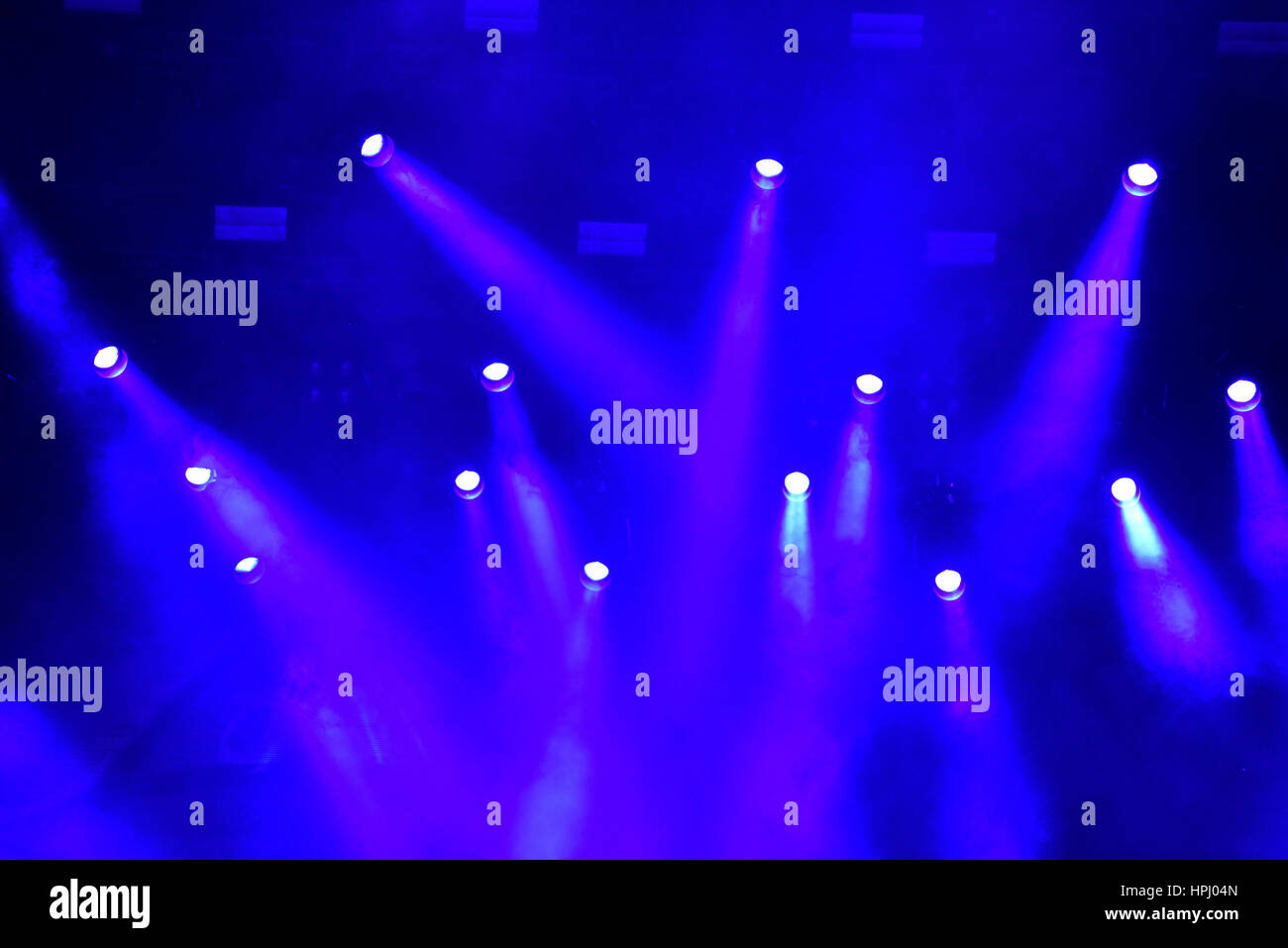 Stage lights. Light projectors in the dark Stock Photo - Alamy