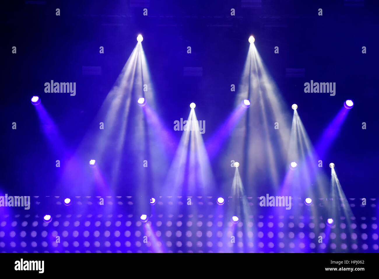 Stage lights. Light projectors in the dark Stock Photo - Alamy