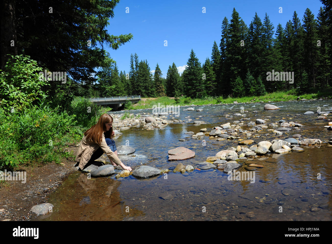 Woman wading in river hi-res stock photography and images - Alamy