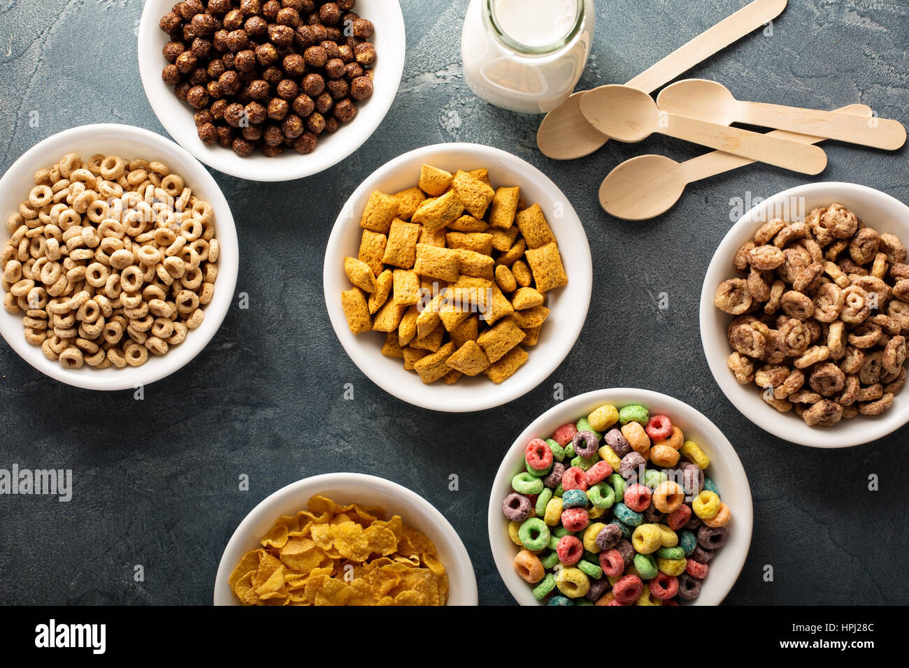 Variety of cold cereals in white bowls, quick breakfast for kids ...