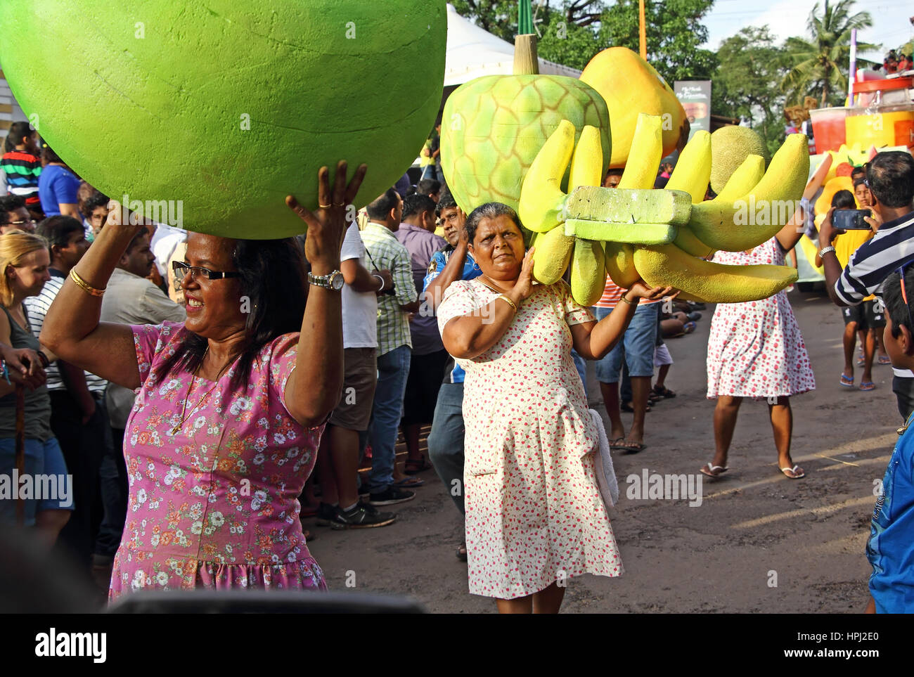 Goa, India : Village women carry huge size models of local fruits in a ...
