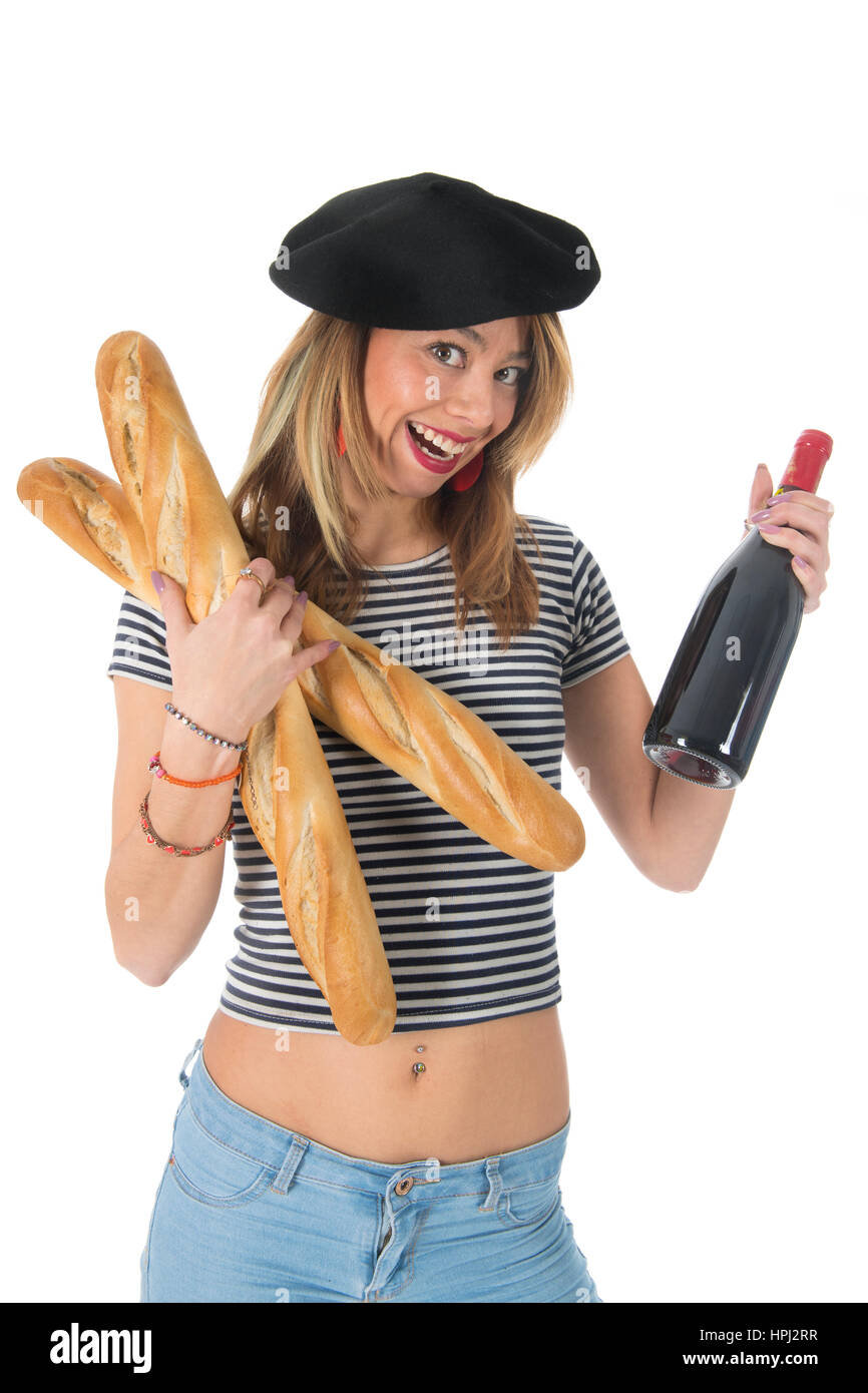 Young French girl with typical French barret and striped shirt bread ...