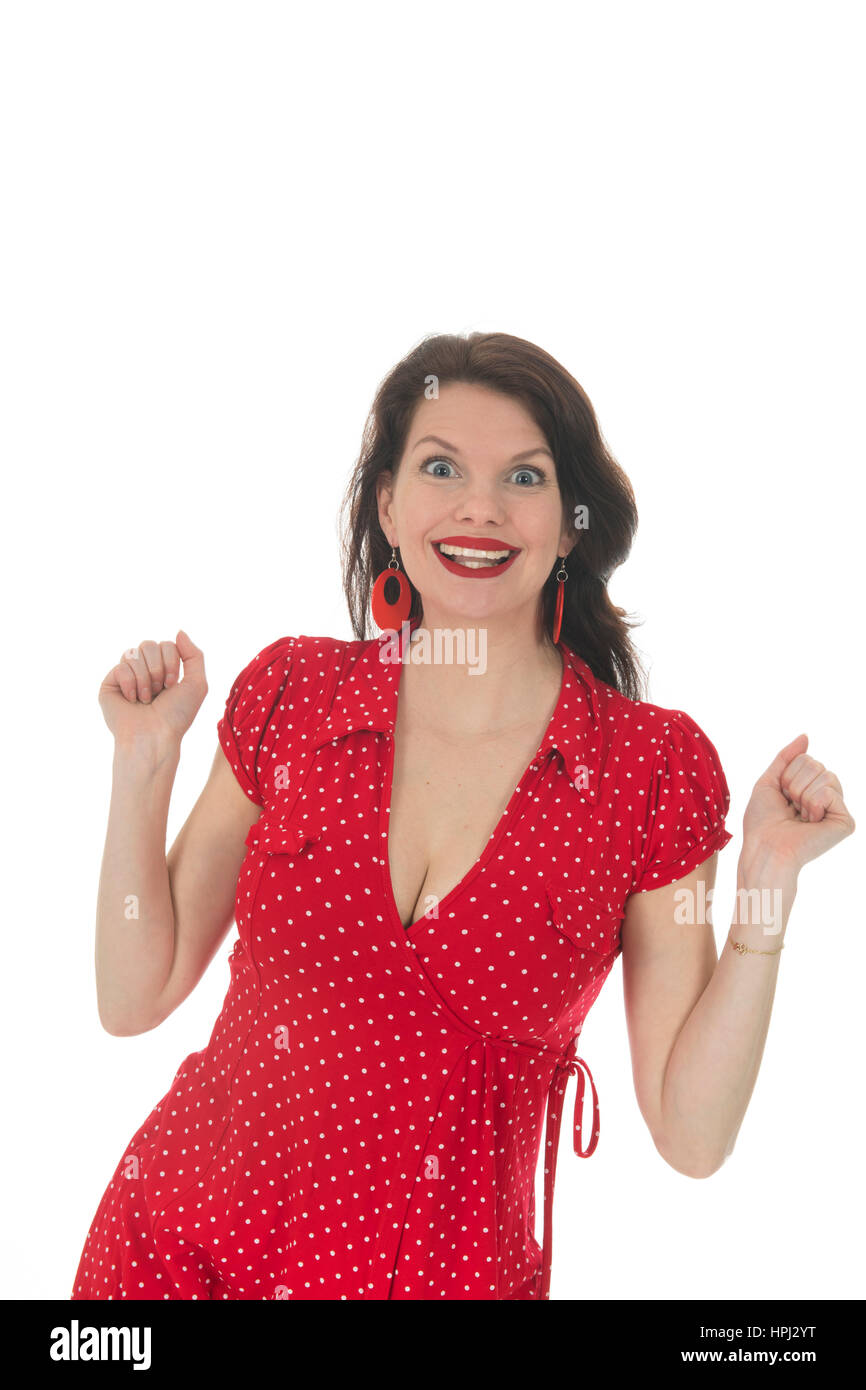 Portrait very excited young woman in red dress isolated over white ...