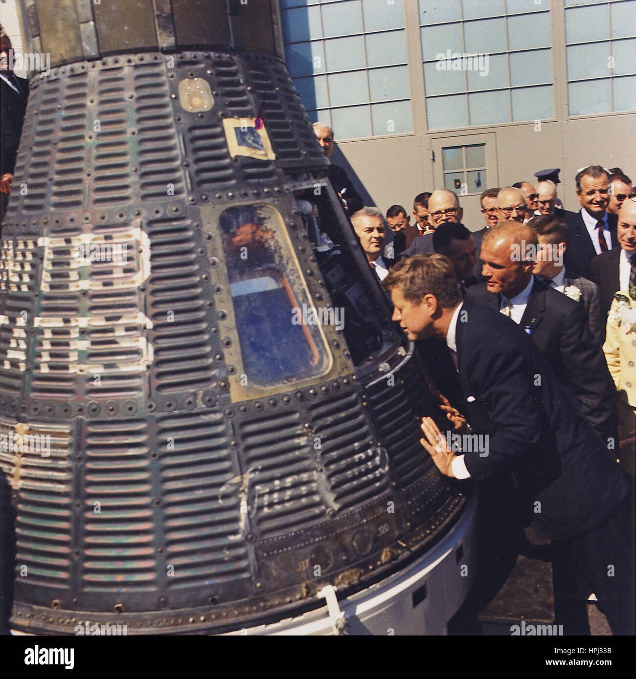 PRESIDENT JOHN F KENNEDY (1917-1963) inspects the Mercury space capsule ...