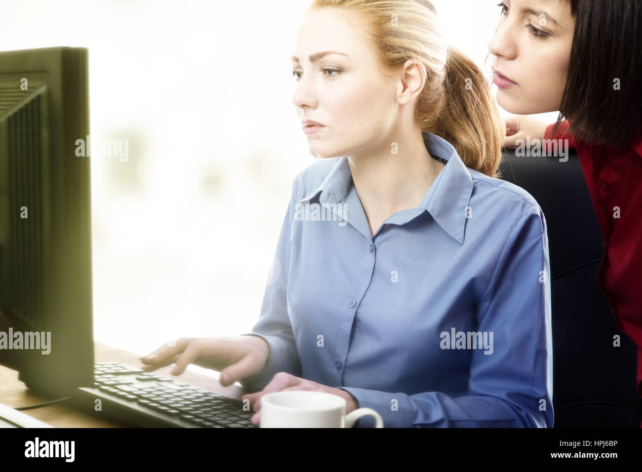 two work colleagues working together in the office Stock Photo - Alamy