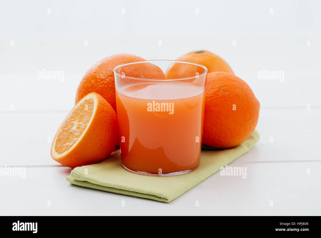 Healthy tasty juice and fresh oranges on the kitchen table: healthy ...