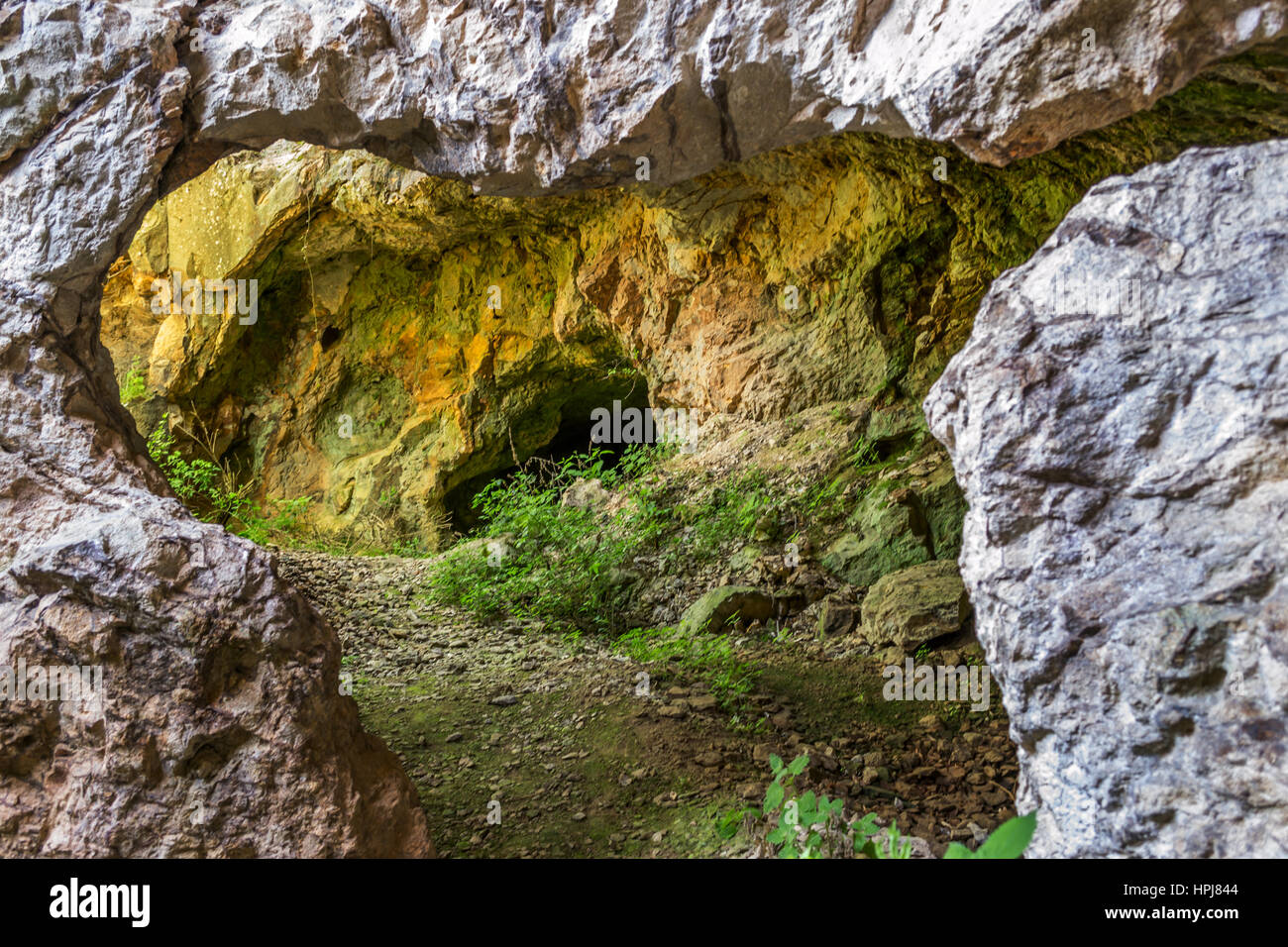Entering the cave, with magical colors Stock Photo - Alamy
